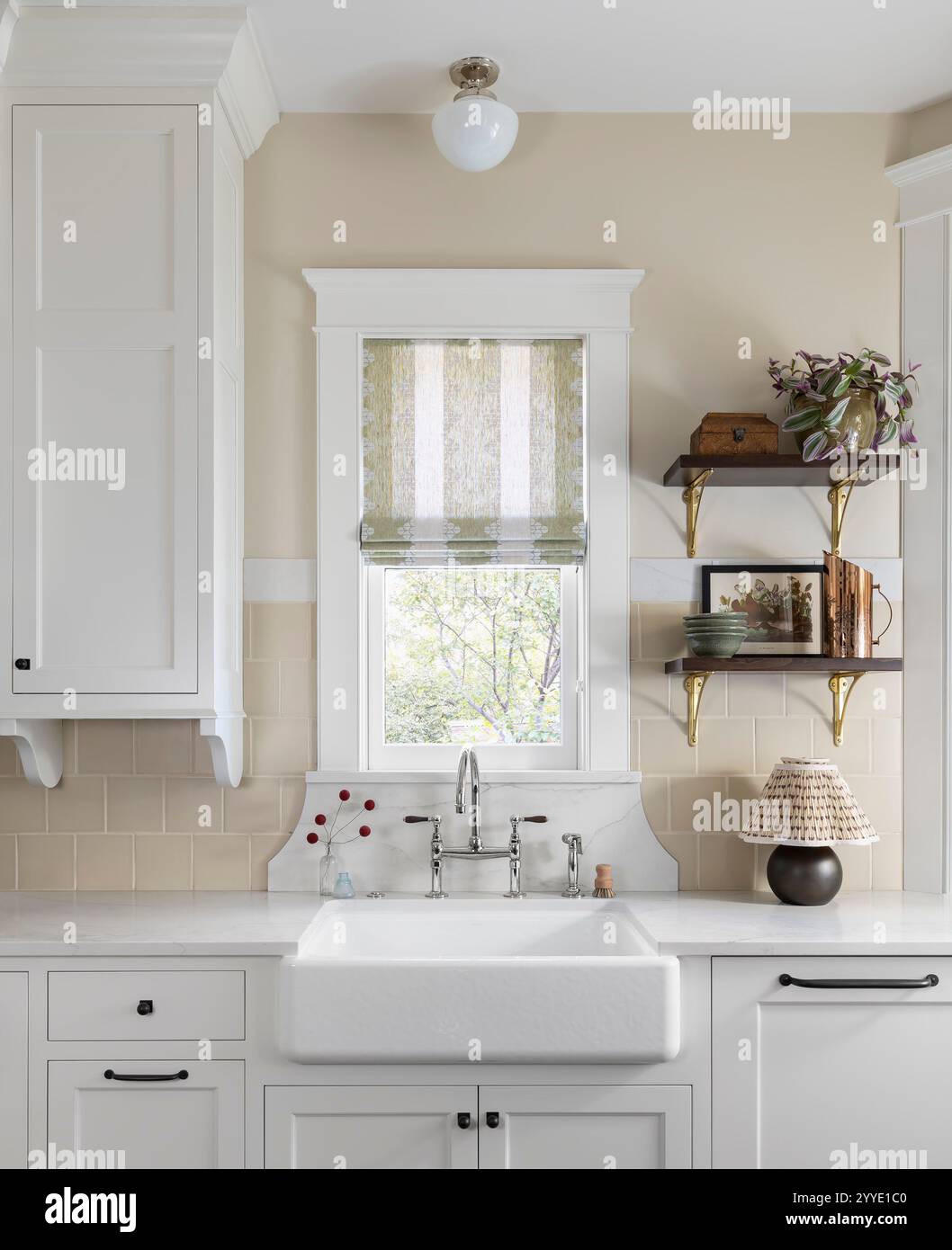 Sink area in kitchen with marble backsplash behind faucet Stock Photo ...