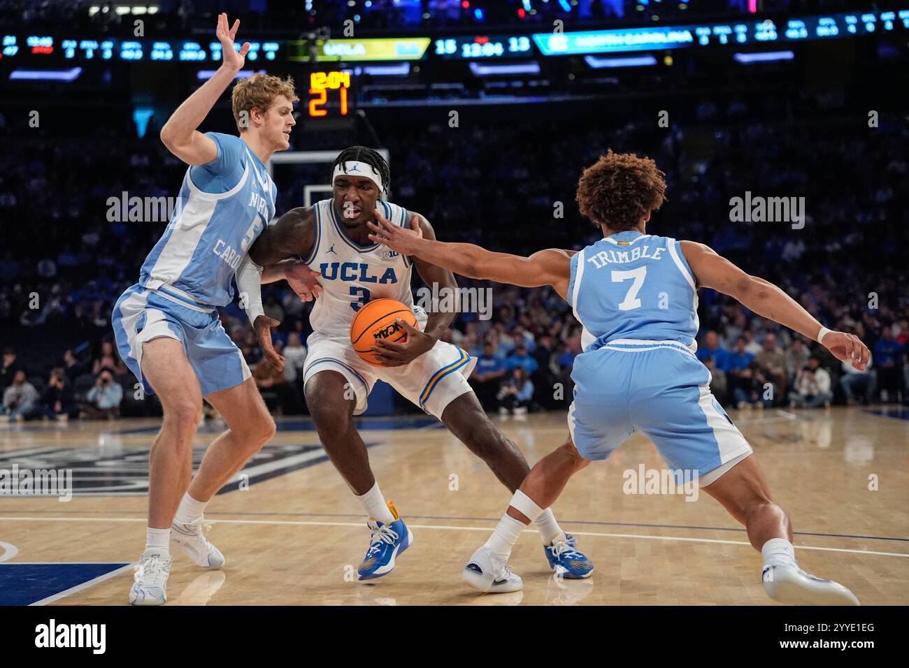 UCLA's Eric Dailey Jr. (3) drives past North Carolina's Cade Tyson (5 ...