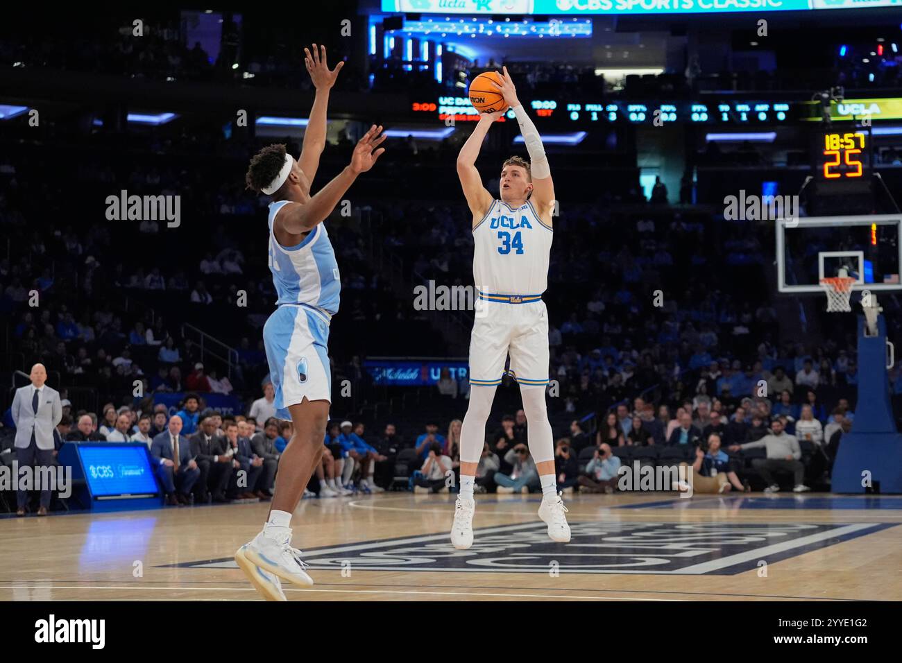 UCLA's Tyler Bilodeau (34) shoots over North Carolina's Ven-Allen Lubin ...