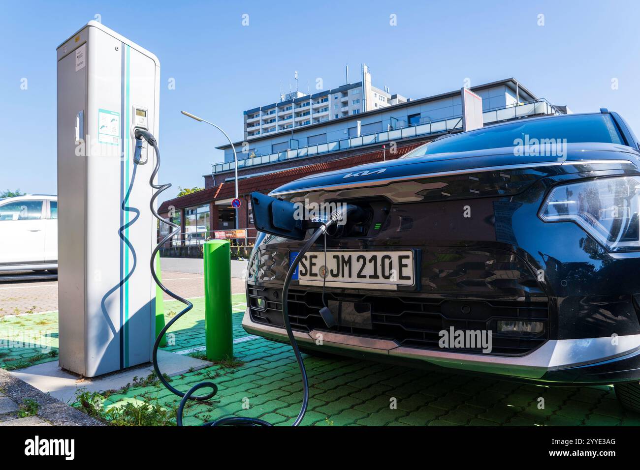 Electric Car Charging at Urban Charging Station in Germany Stock Photo ...