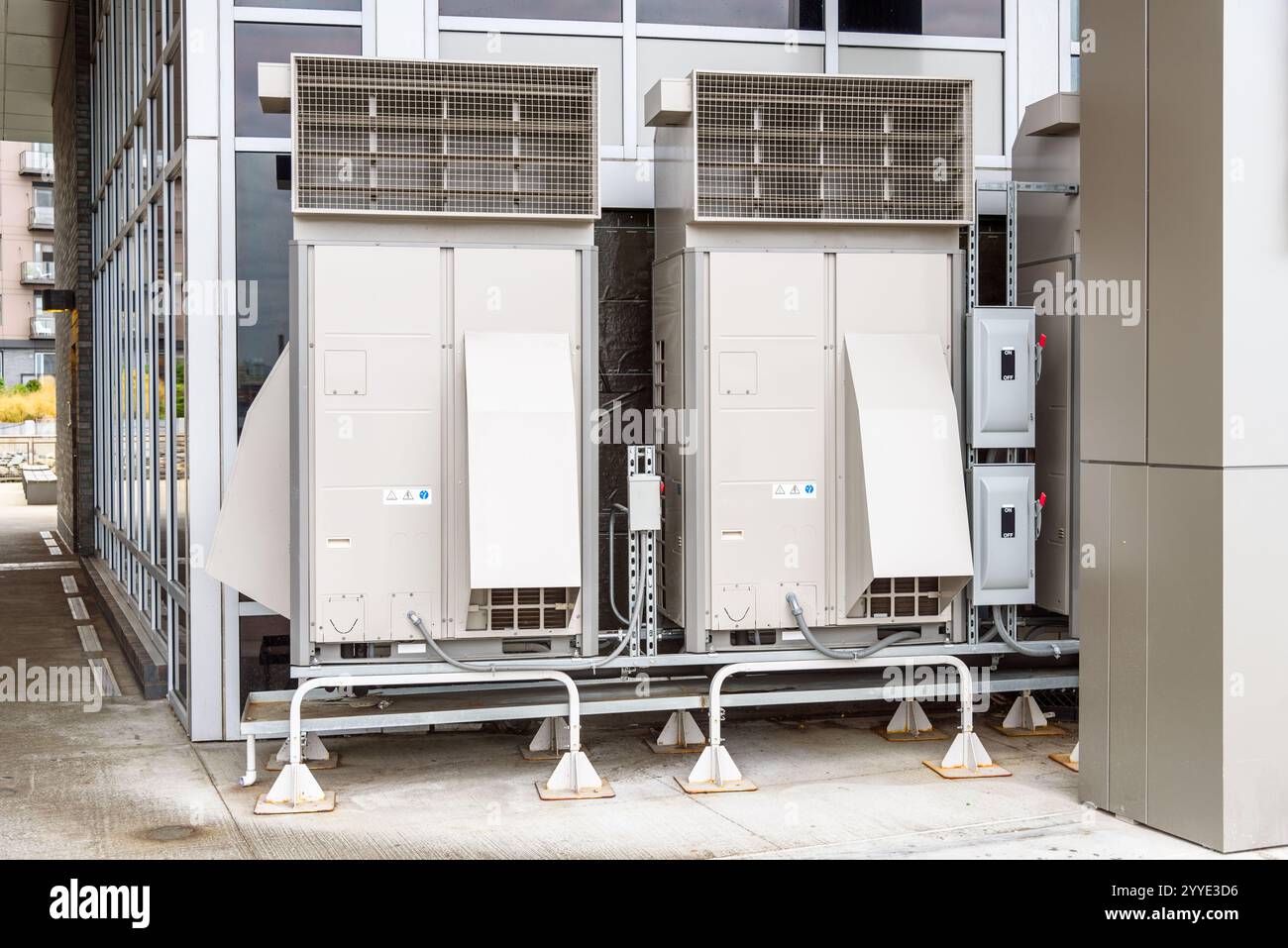 Large Hac outdoor units on the ground floor of a modern apartment ...