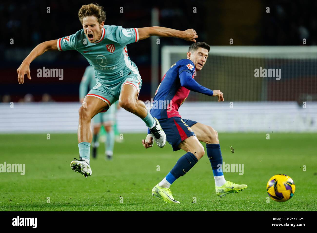 Barcelona's Robert Lewandowski, right, and Atletico Madrid's Marcos ...