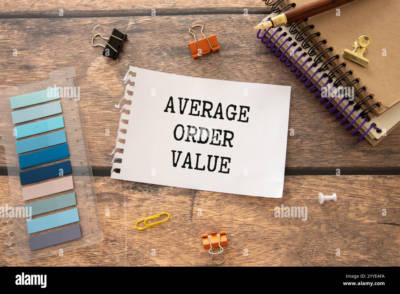 AVERAGE ORDER VALUE. Black marker on torn cardboard background Stock ...