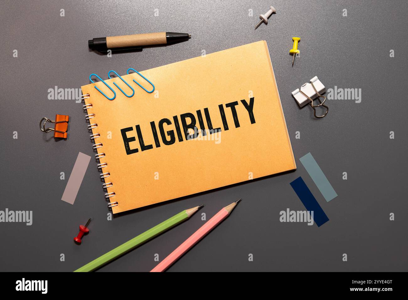 Eligibility writing text post it paper in office on laptop computer ...