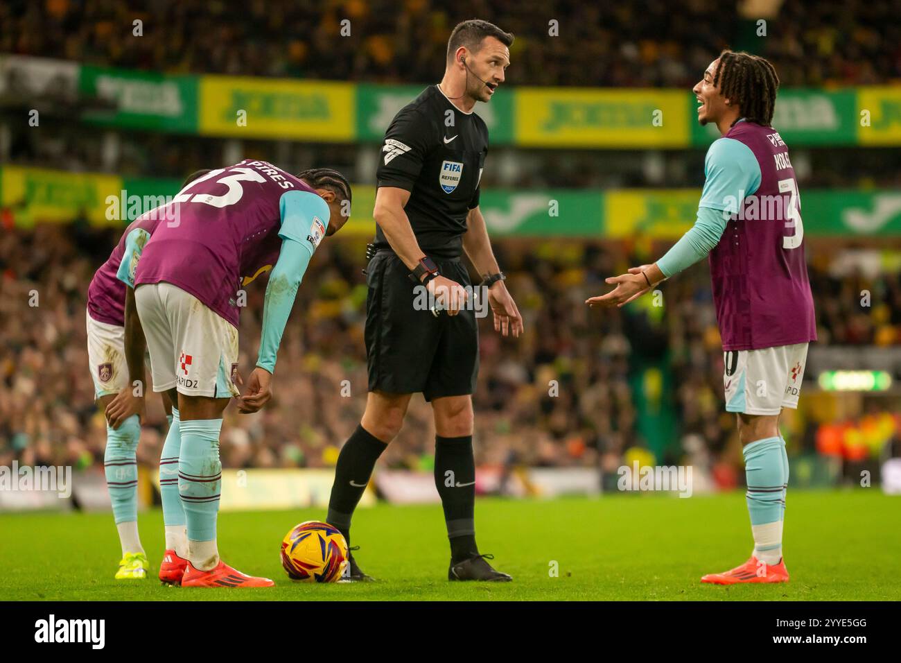 Luca Koleosho of Burnley interacts with Referee Andrew Madley during ...