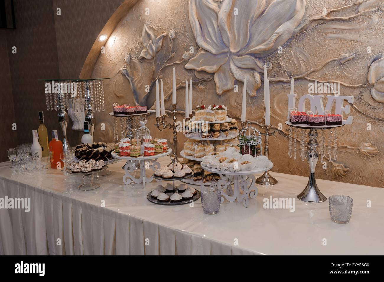 Elegant Dessert Table Display at a Celebration with Floral Background Stock Photo - Alamy