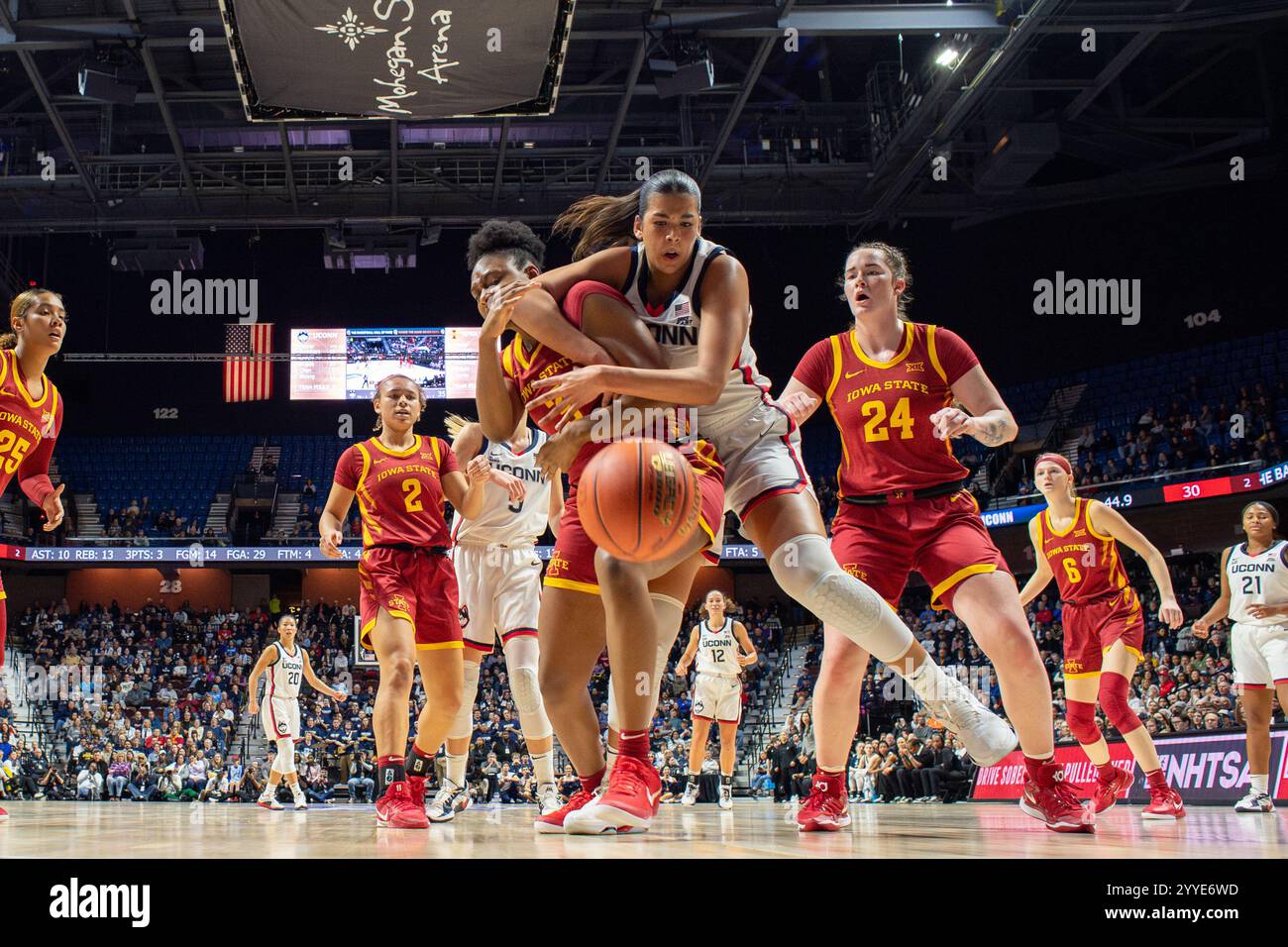 Uncasville, CT, USA. 17th Dec, 2024. UConn Huskies center Jana El Alfy (8) looks to a loose ball ...