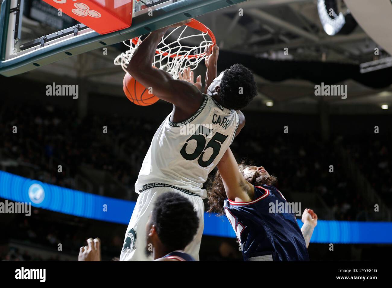Michigan State forward Coen Carr (55) dunks against Florida Atlantic ...