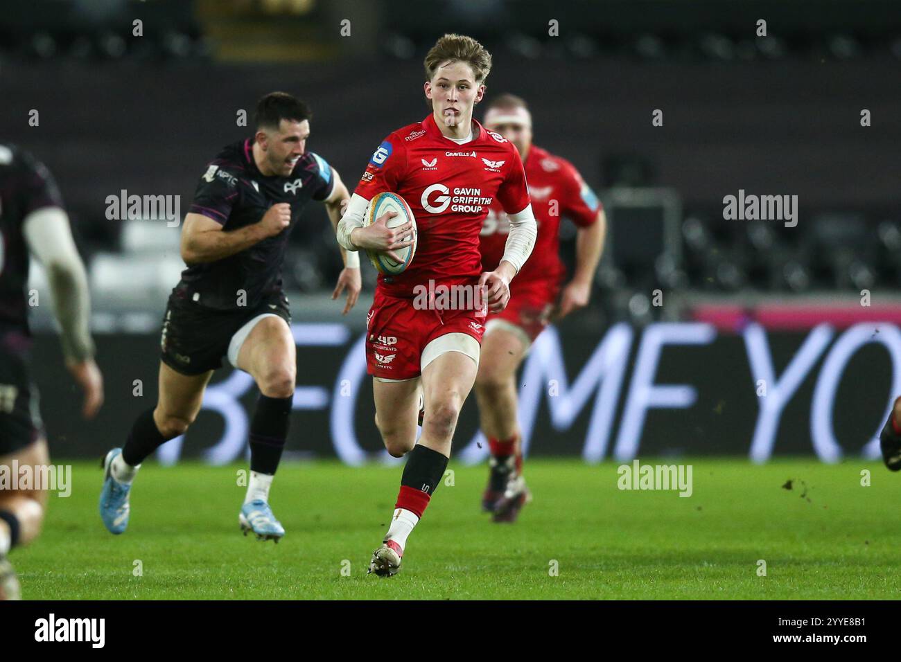 Swansea, UK. 21 December, 2024. Ellis Mee of Scarlets on the attack ...