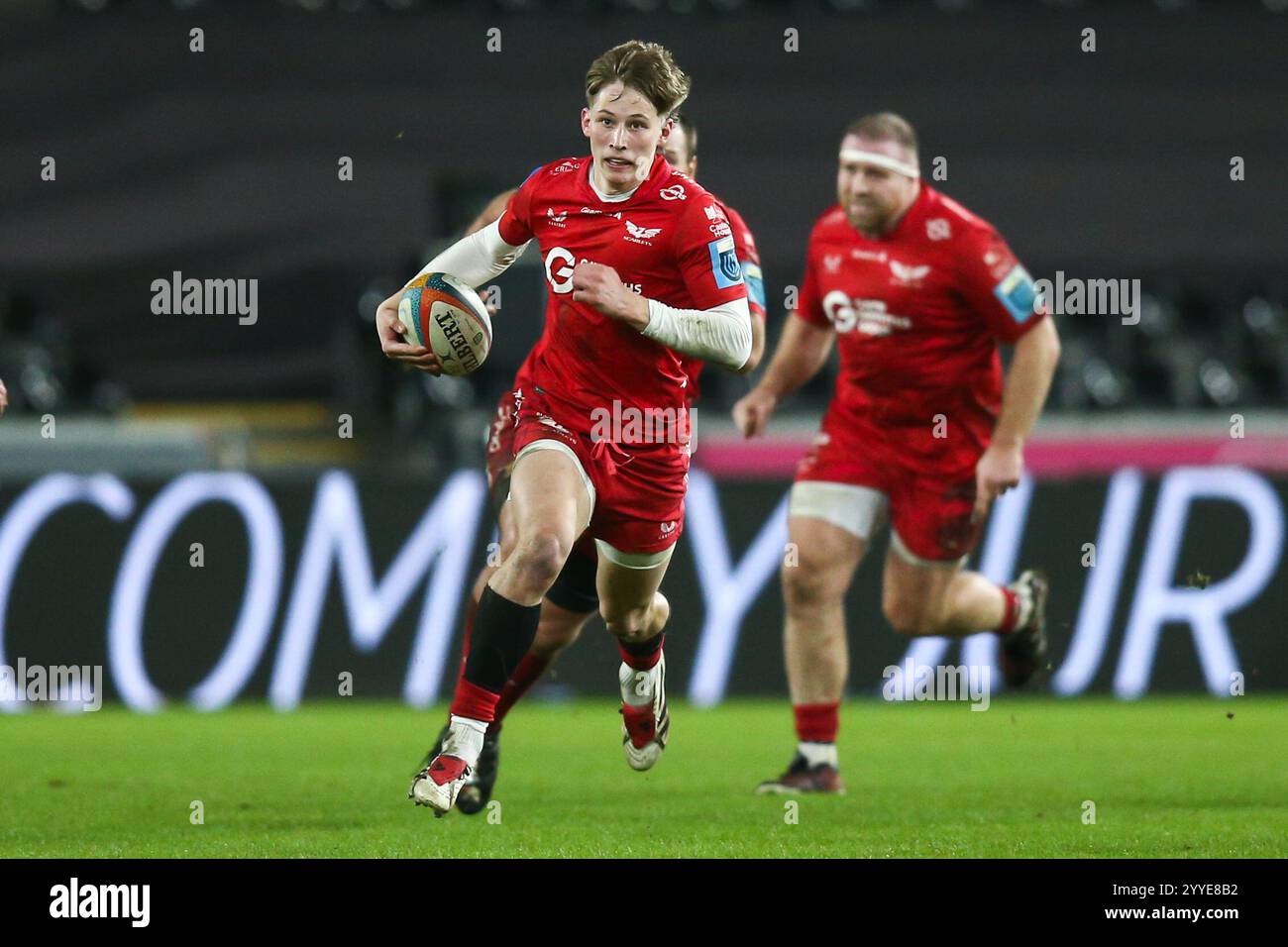 Swansea, UK. 21 December, 2024. Ellis Mee of Scarlets on the attack ...