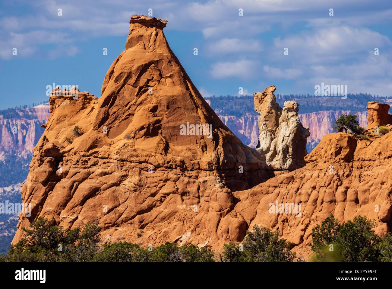 Monolithic stone spires of colorful sandstone dot the countryside at ...