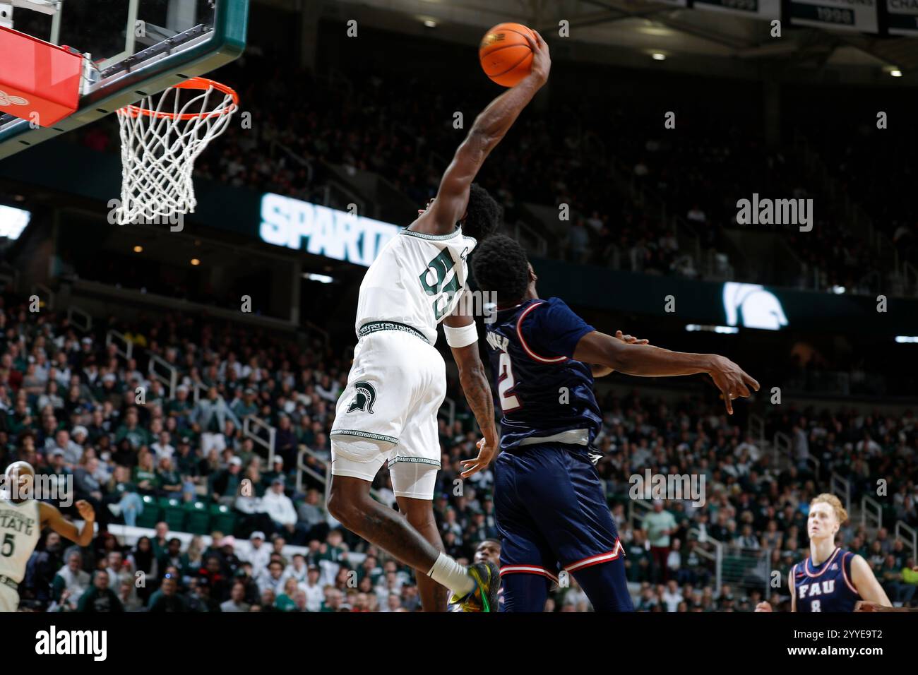 Michigan State forward Coen Carr (55) goes up for a dunk against ...