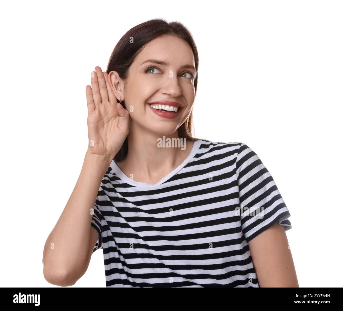 Woman showing hand to ear gesture on white background Stock Photo - Alamy