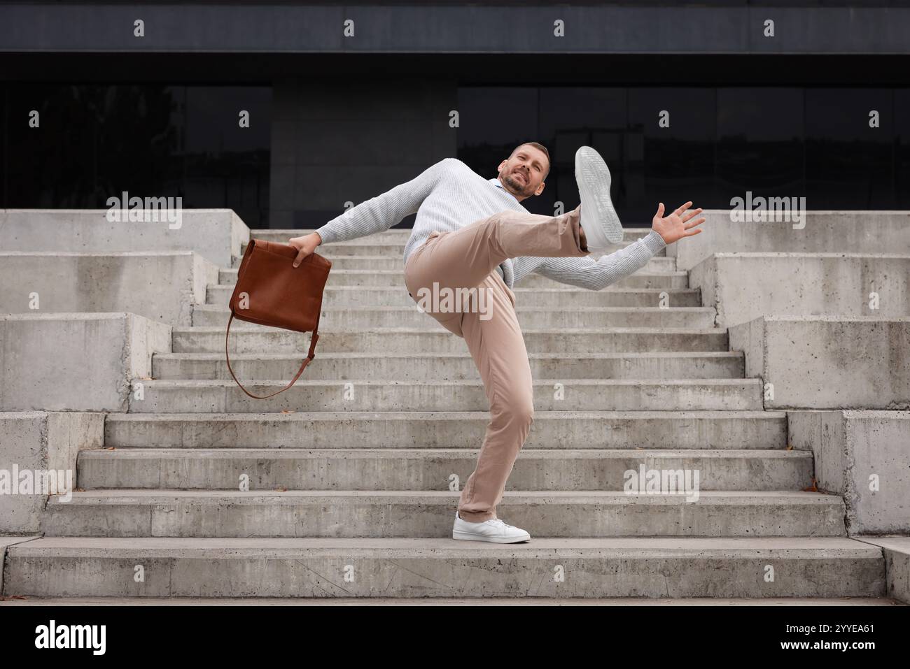 Man falling on stairs outdoors. Dangerous accident Stock Photo - Alamy