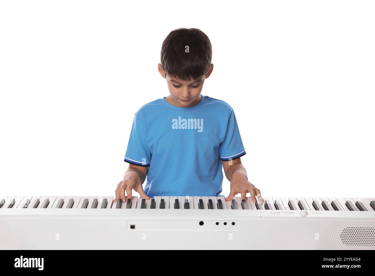 Cute boy playing synthesizer on white background Stock Photo - Alamy