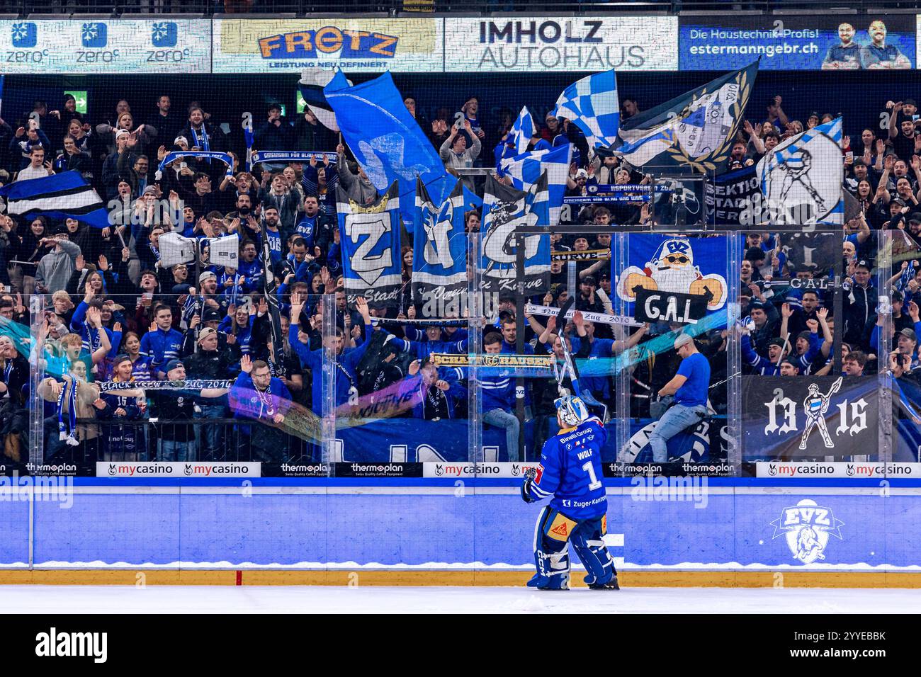 The Zug fans celebrate goalkeeper Tim Wolf #1 (EV Zug) after his ...