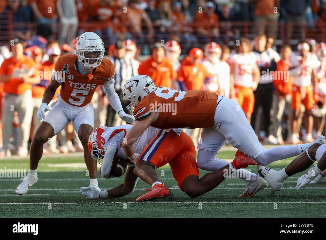 AUSTIN, TX - DECEMBER 21: Texas Longhorns linebacker Ethan Burke (91) brings down Clemson Tigers ...