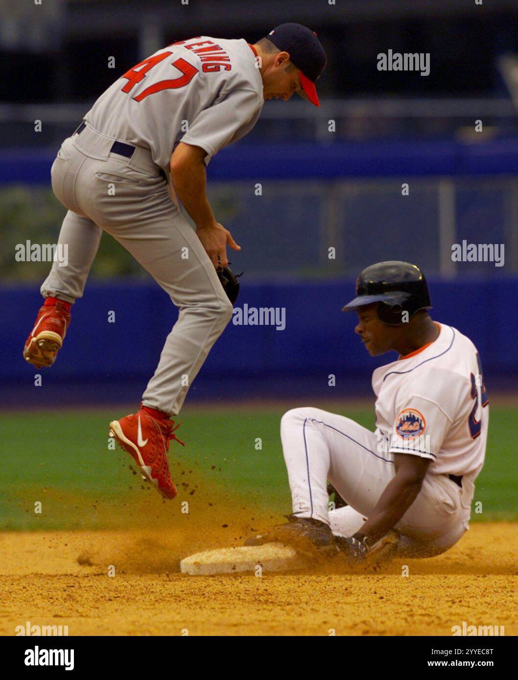 FILE - New York Mets' Rickey Henderson, right, slides safely into ...