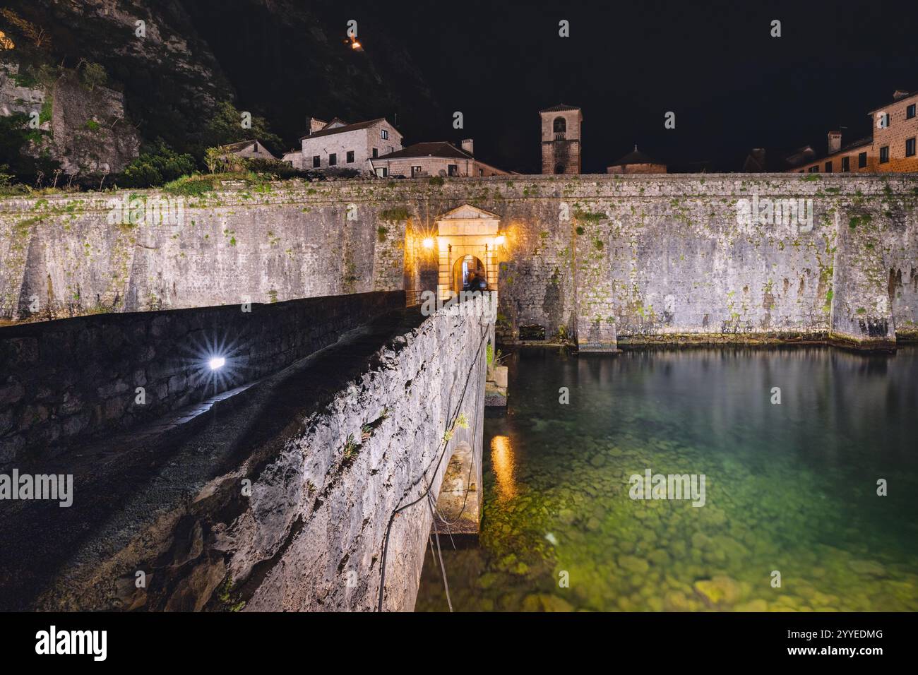 25 October 2024, Kotor, Montenegro: Bridge leading to the illuminated ...