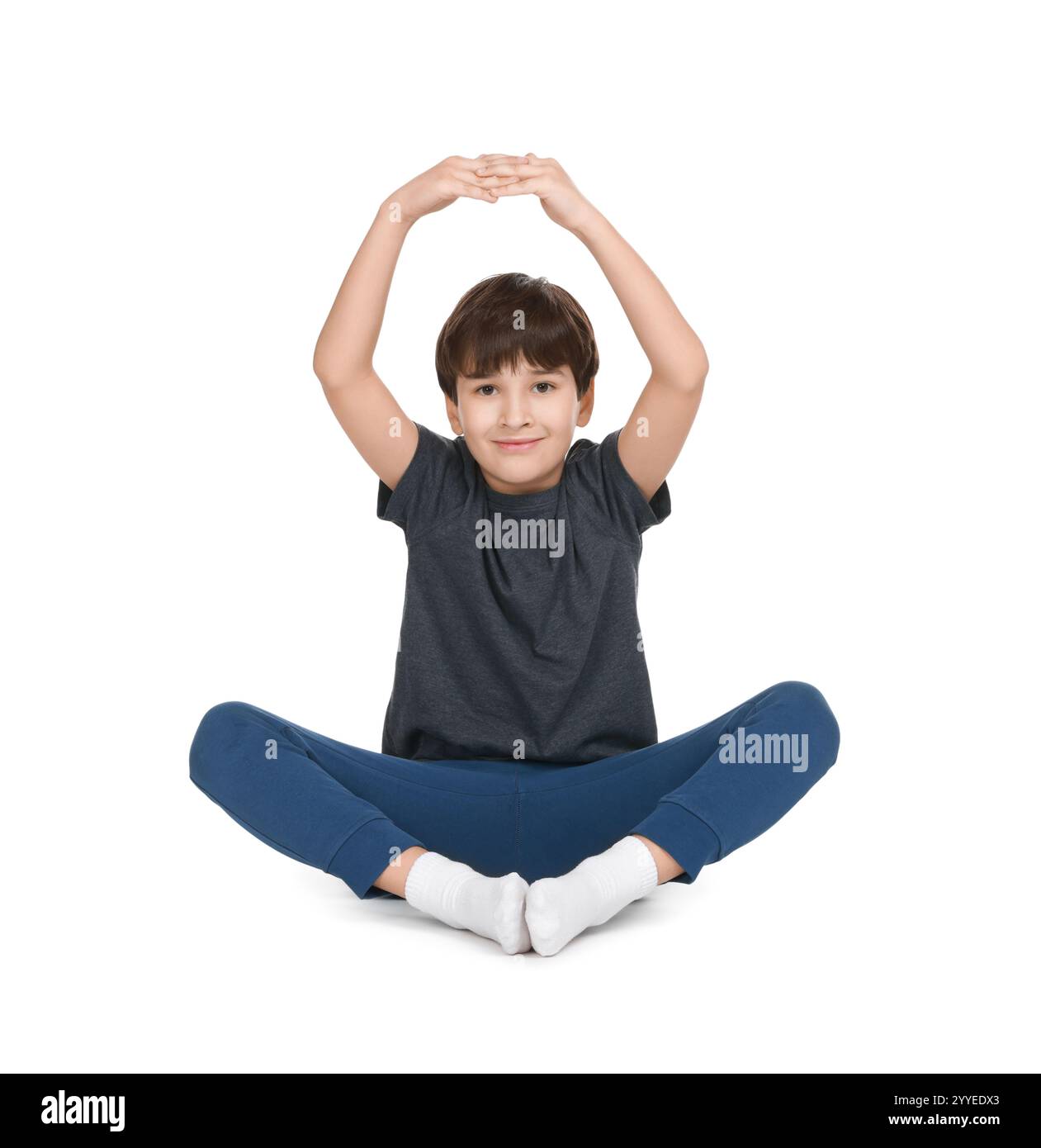Boy doing exercise on white background. Sport activity Stock Photo - Alamy