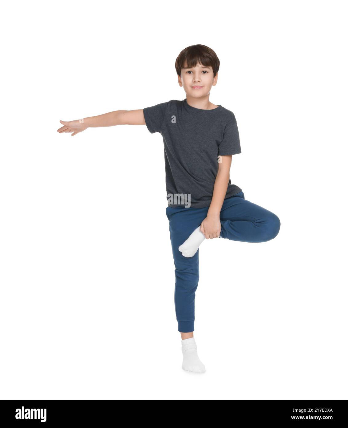 Boy doing exercise on white background. Sport activity Stock Photo - Alamy
