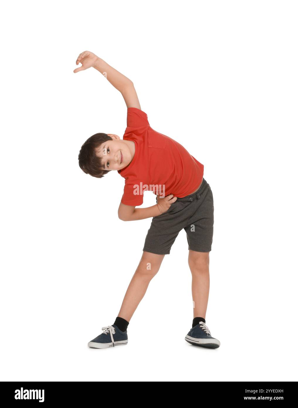 Boy doing exercise on white background. Sport activity Stock Photo - Alamy