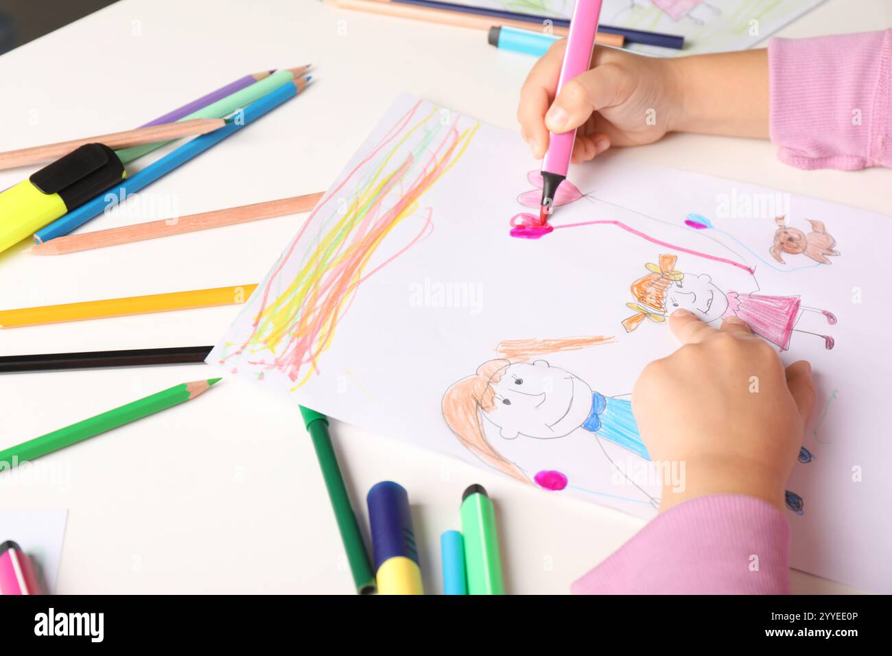 Little girl drawing his family at white table, closeup Stock Photo - Alamy