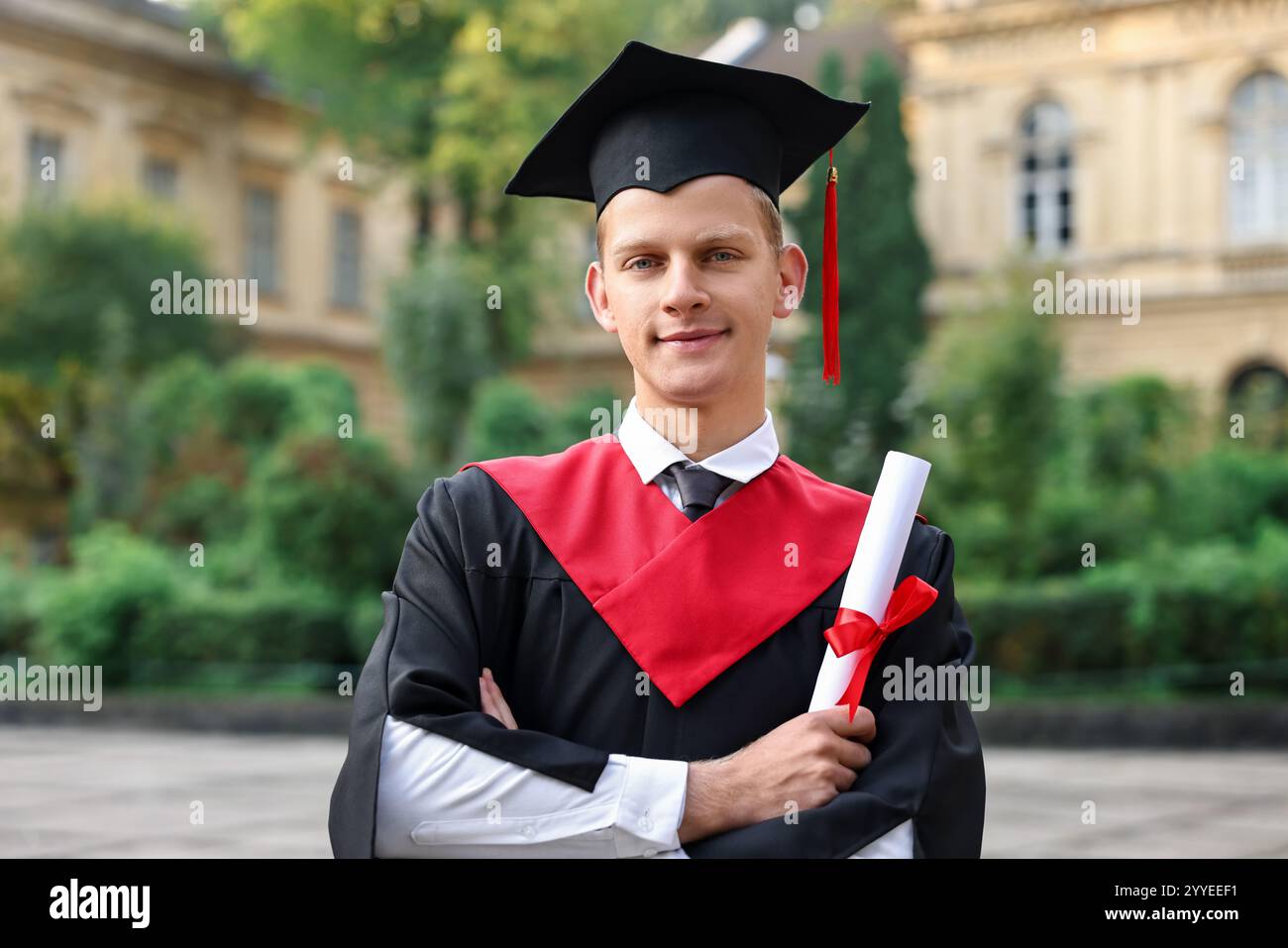 Student with diploma after graduation ceremony outdoors Stock Photo - Alamy