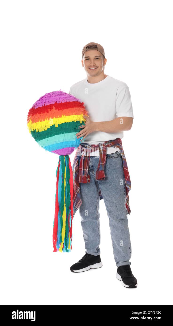 Happy man with colorful pinata on white background Stock Photo - Alamy