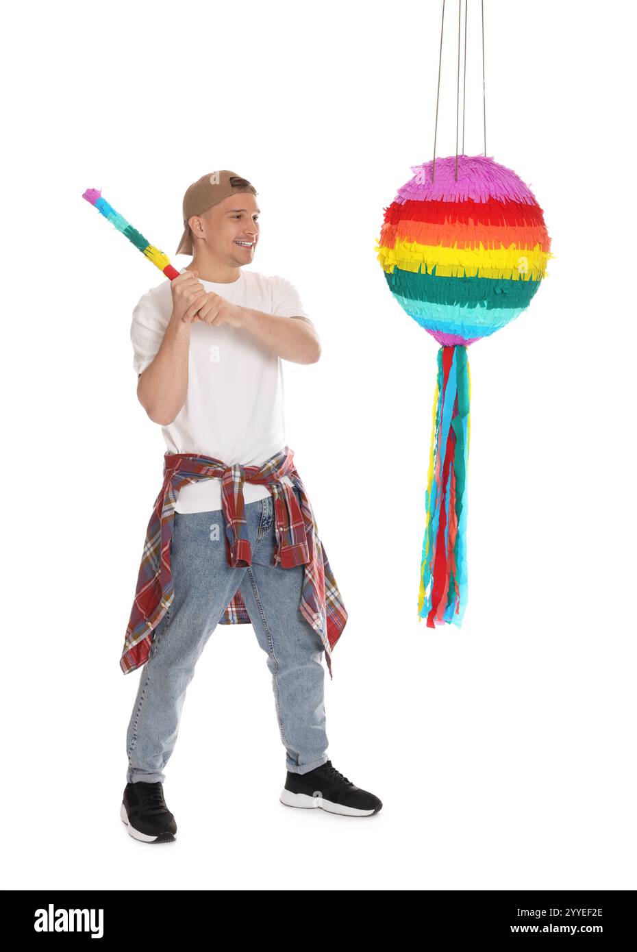 Happy man breaking pinata on white background Stock Photo - Alamy
