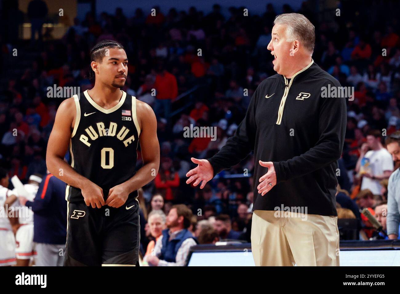 Purdue head coach Matt Painter talks with guard C.J. Cox (0) during the ...