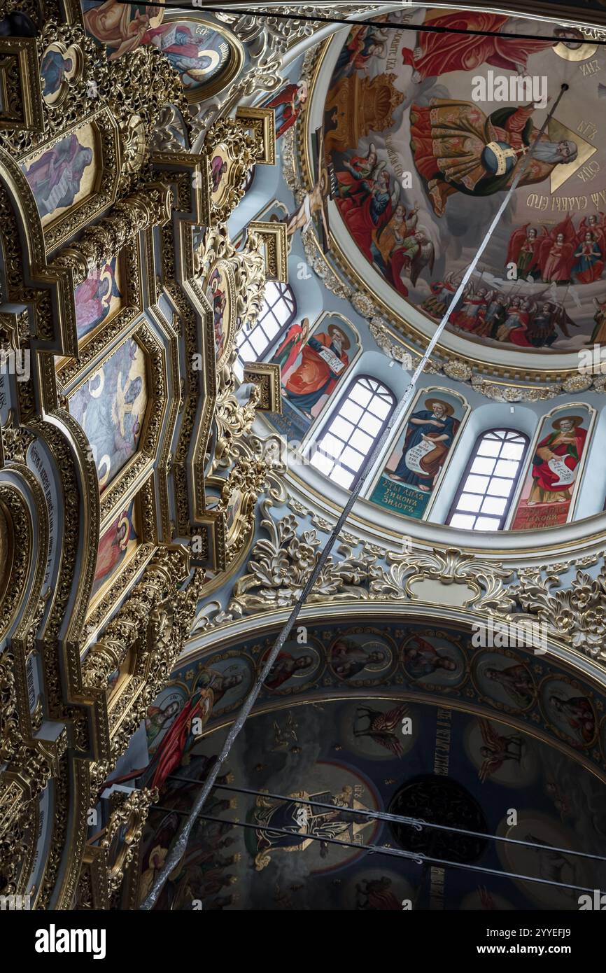 The inside of a church with gold and blue decorations. The ceiling is ...