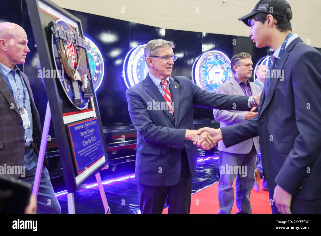 Phoenix, USA. 21st Dec, 2024. General Flynn talks to attendees at ...