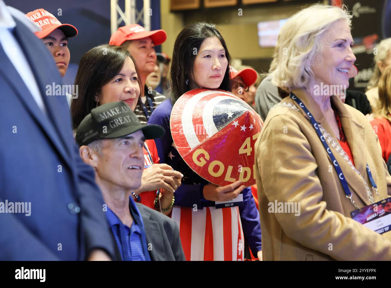 Phoenix, USA. 21st Dec, 2024. People cheer as they gather around to ...