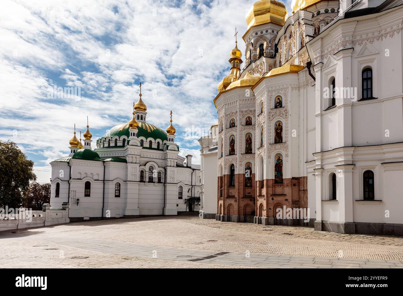 A large white building with a green dome sits in front of a large white ...