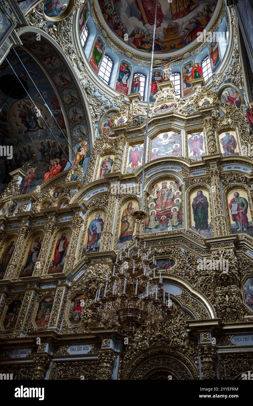 The inside of a church is decorated with gold and silver. The walls are ...