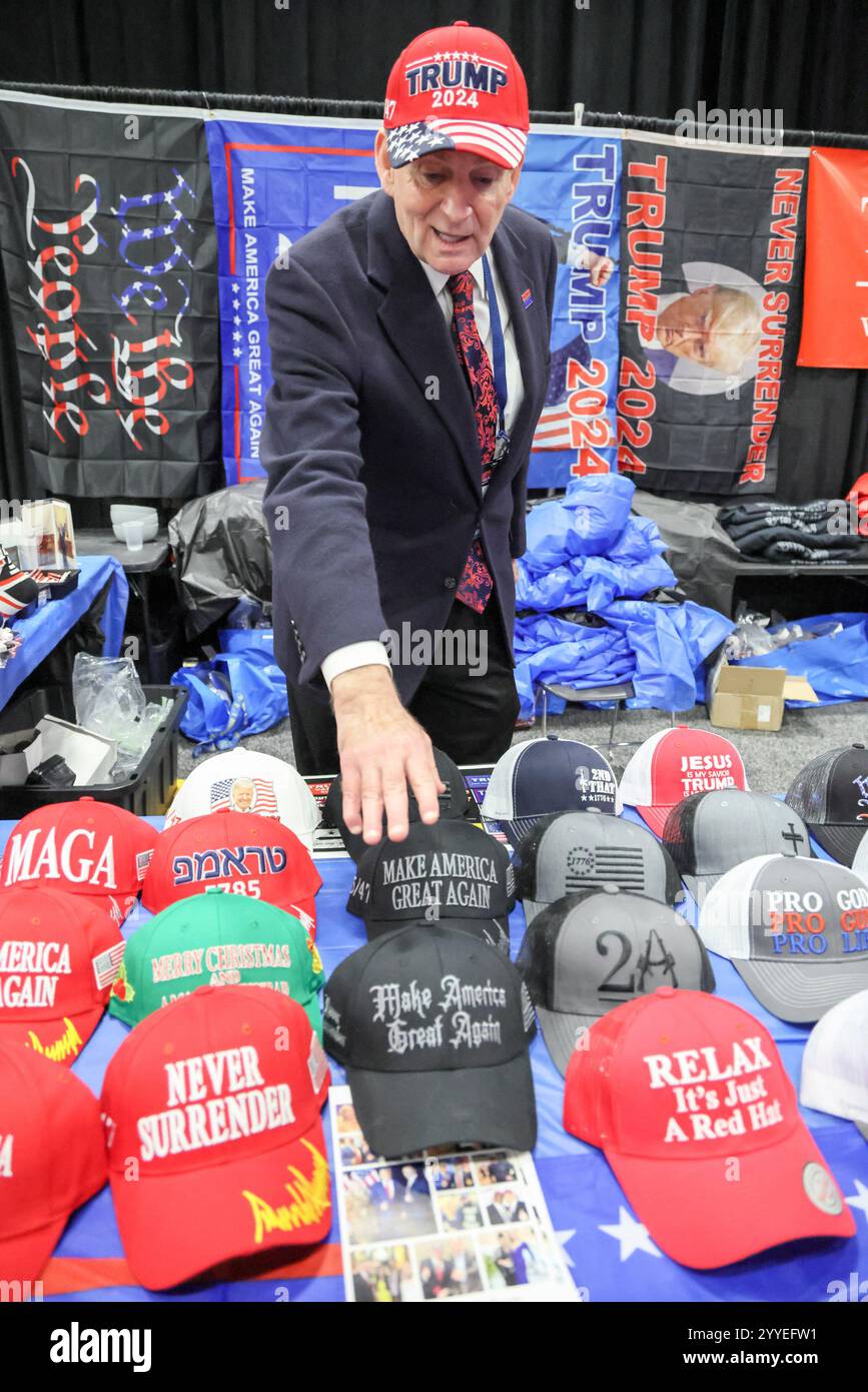 Phoenix, USA. 21st Dec, 2024. Ron Soloman, owner of The MAGA Mall sells ...