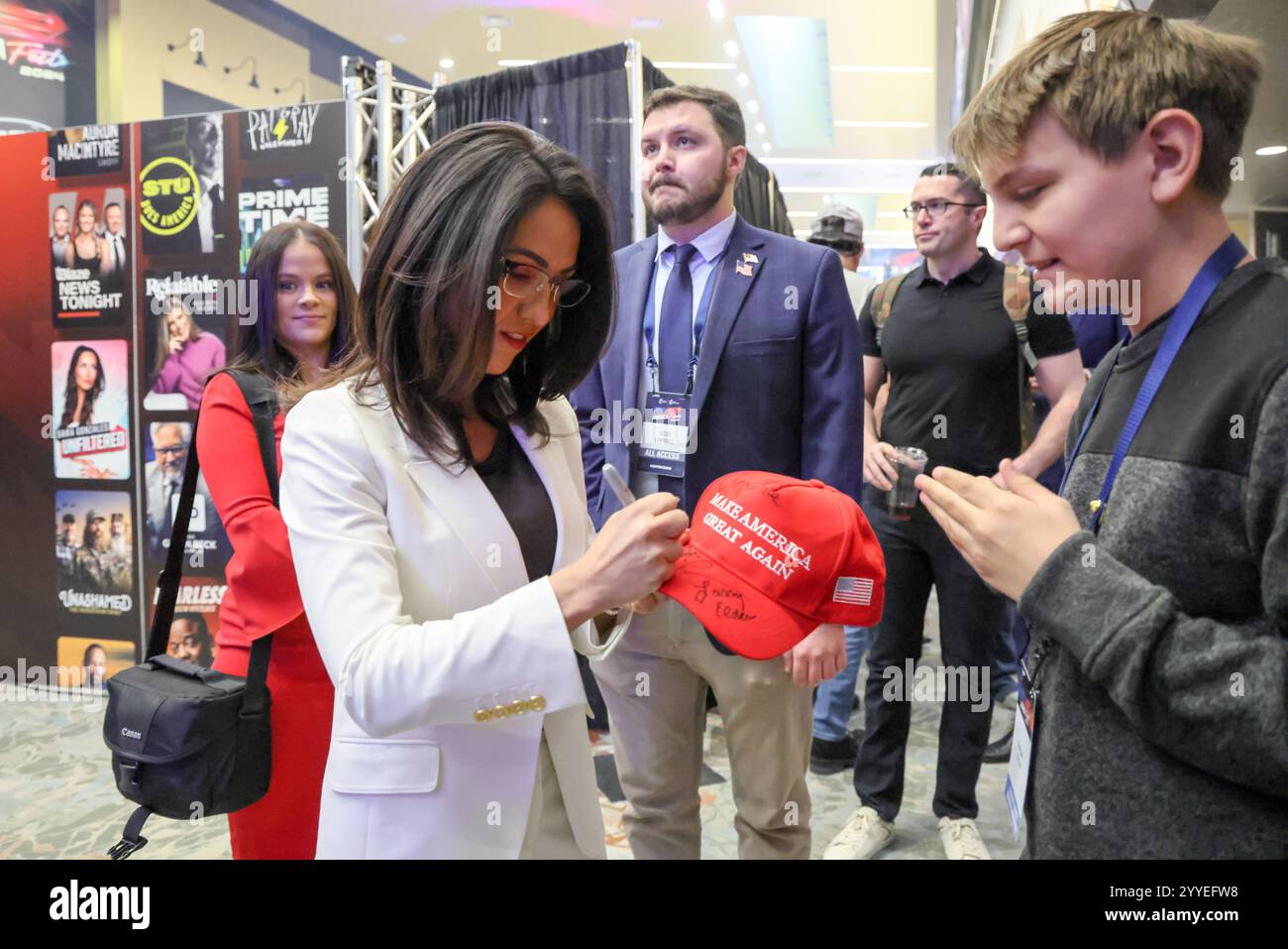 Phoenix, USA. 21st Dec, 2024. Congresswoman Lauren Boebert signs a hat ...