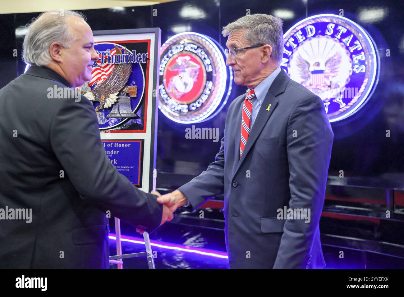 Phoenix, USA. 21st Dec, 2024. General Flynn talks to attendees at ...