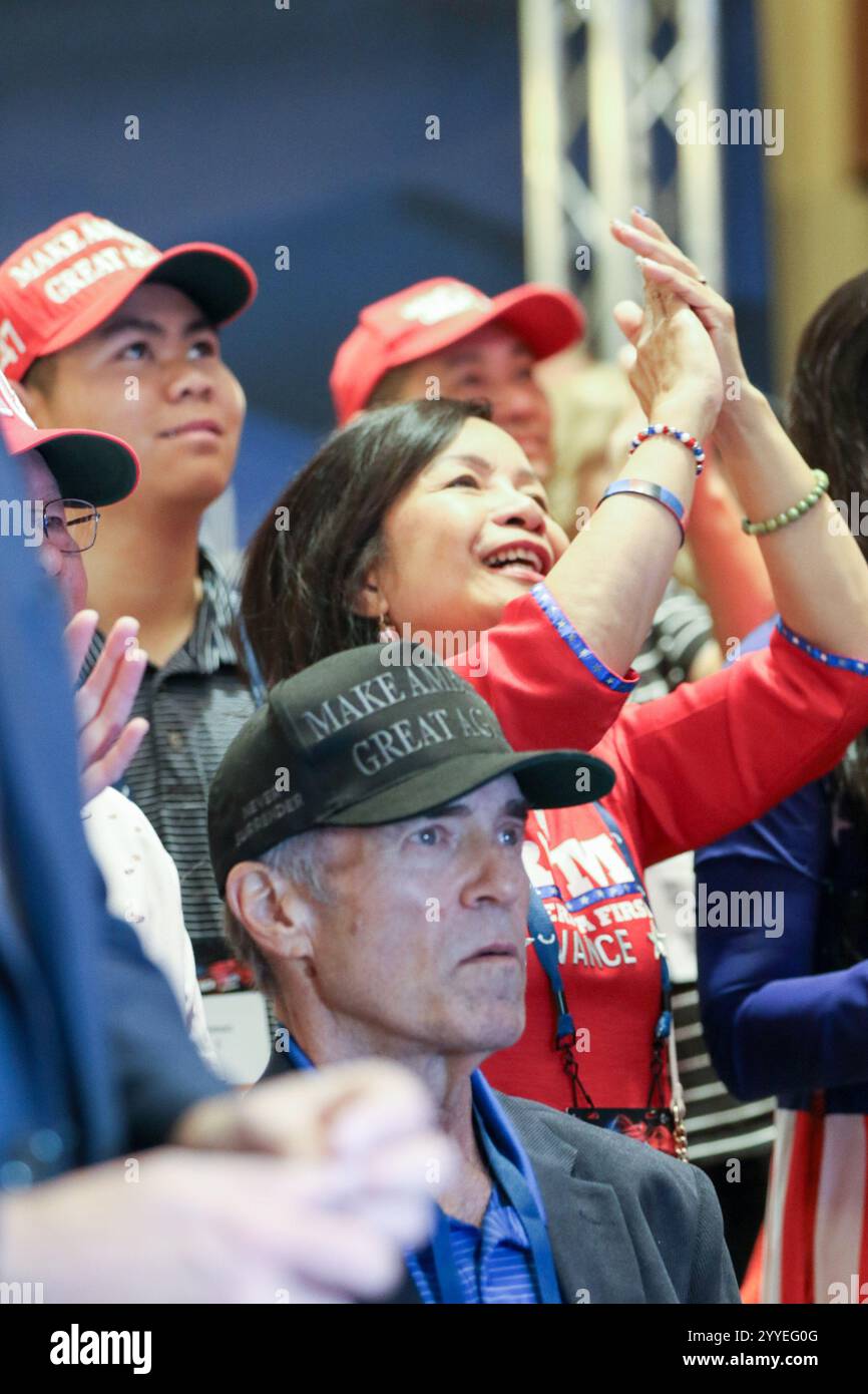 Phoenix, USA. 21st Dec, 2024. People cheer as they gather around to ...