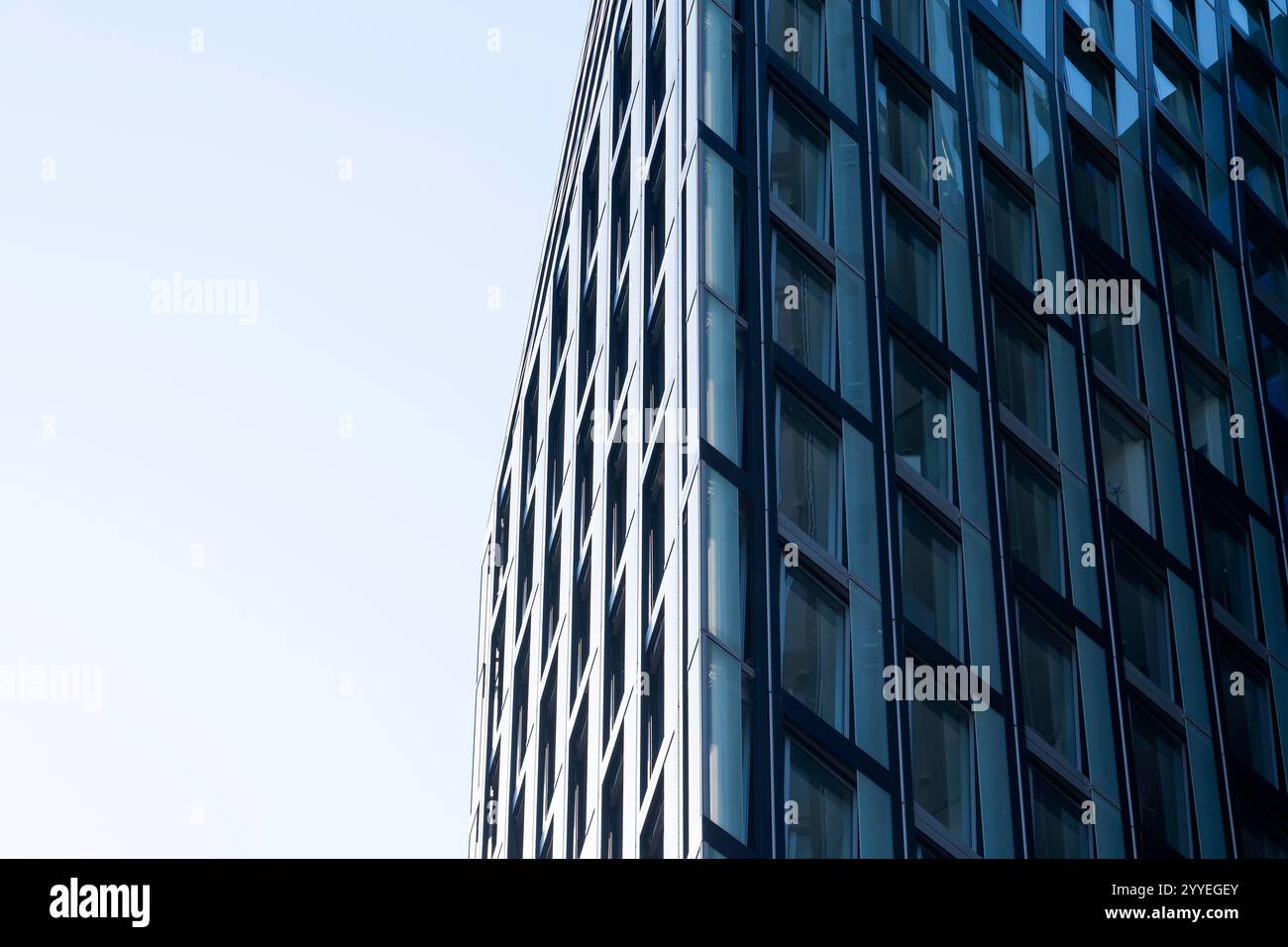 Modern Glass Skyscraper with Geometric Window Patterns against Clear ...