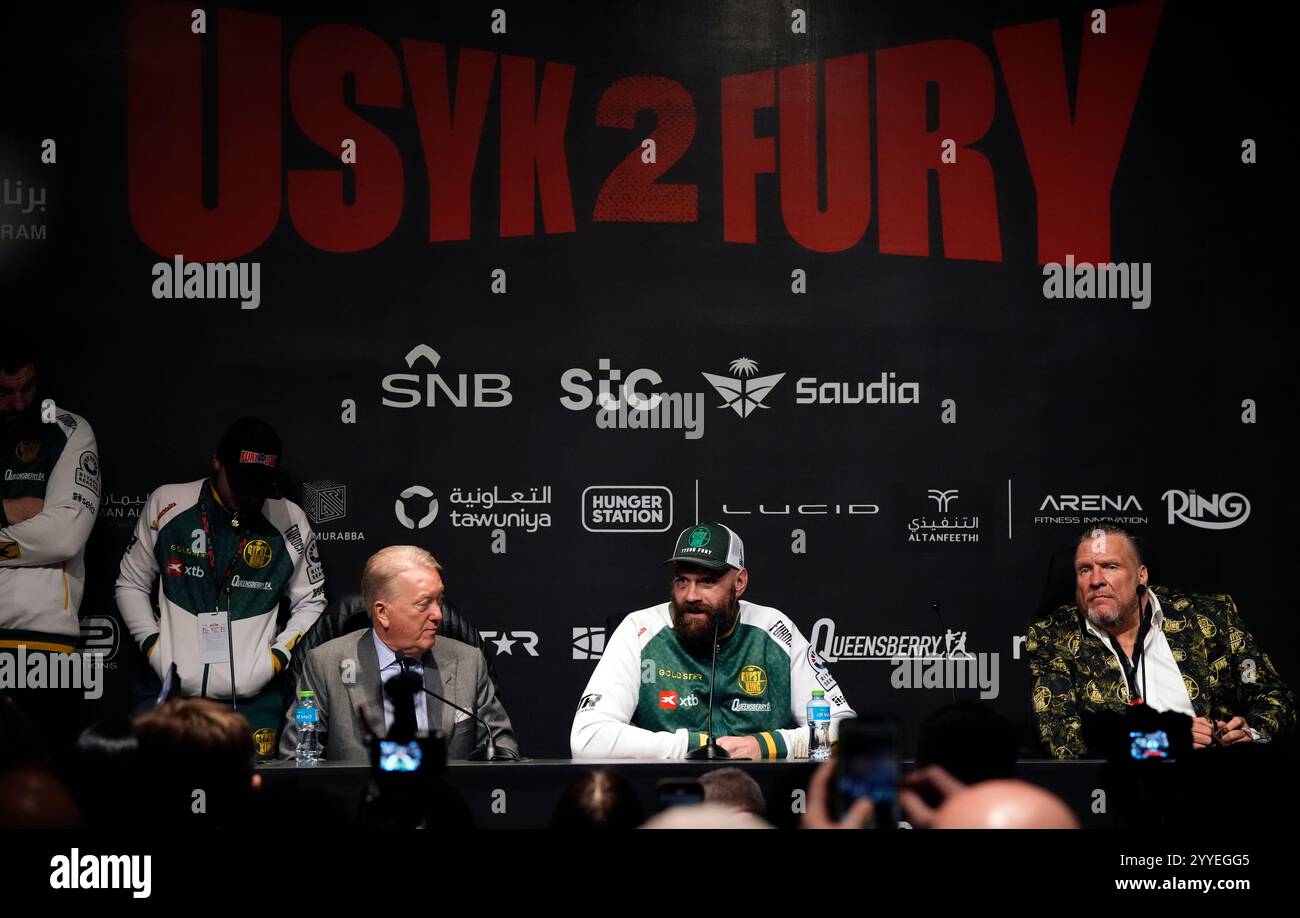Tyson Fury (centre) with Frank Warren and Spencer Brown (right) during ...