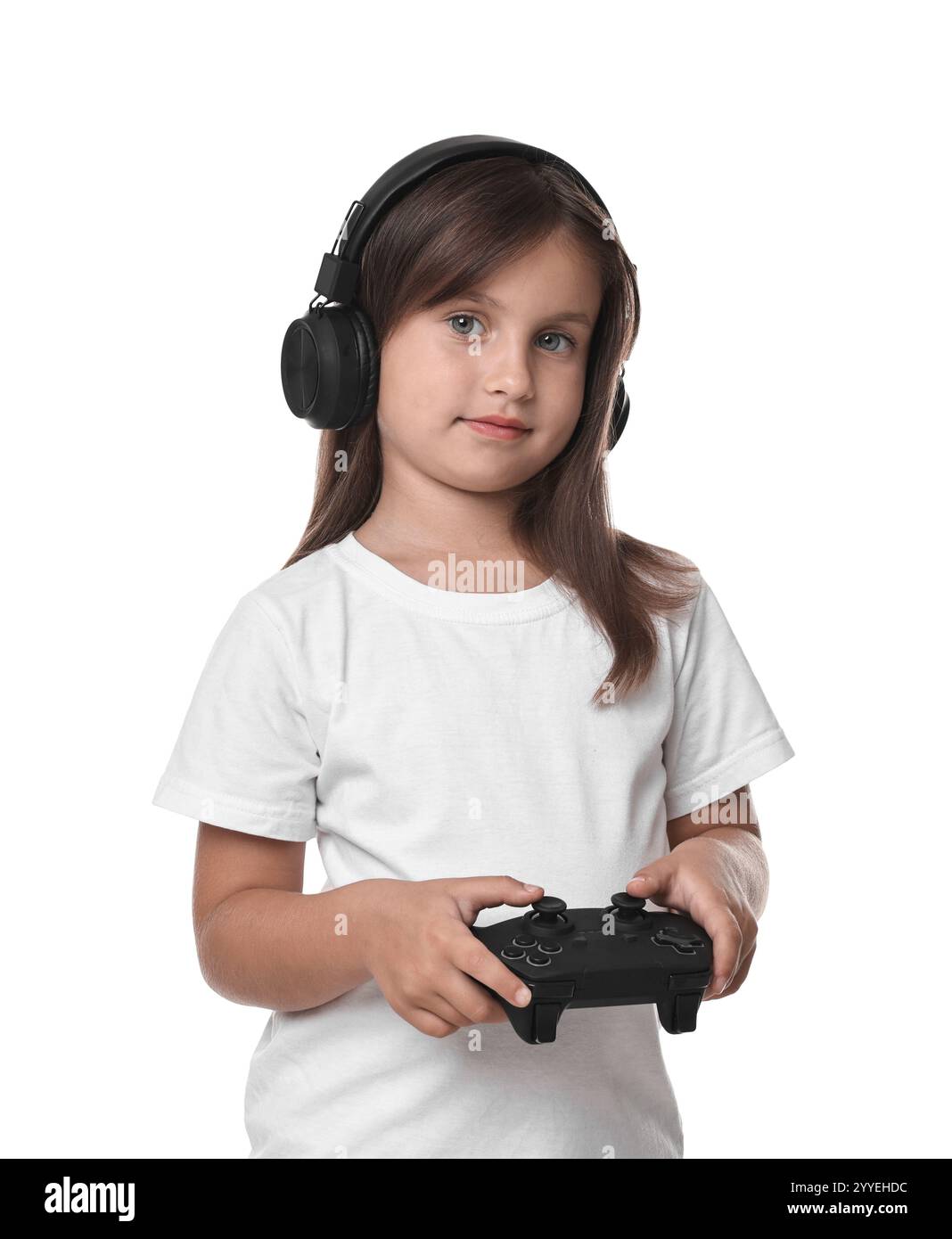 Cute little girl with controller on white background Stock Photo - Alamy