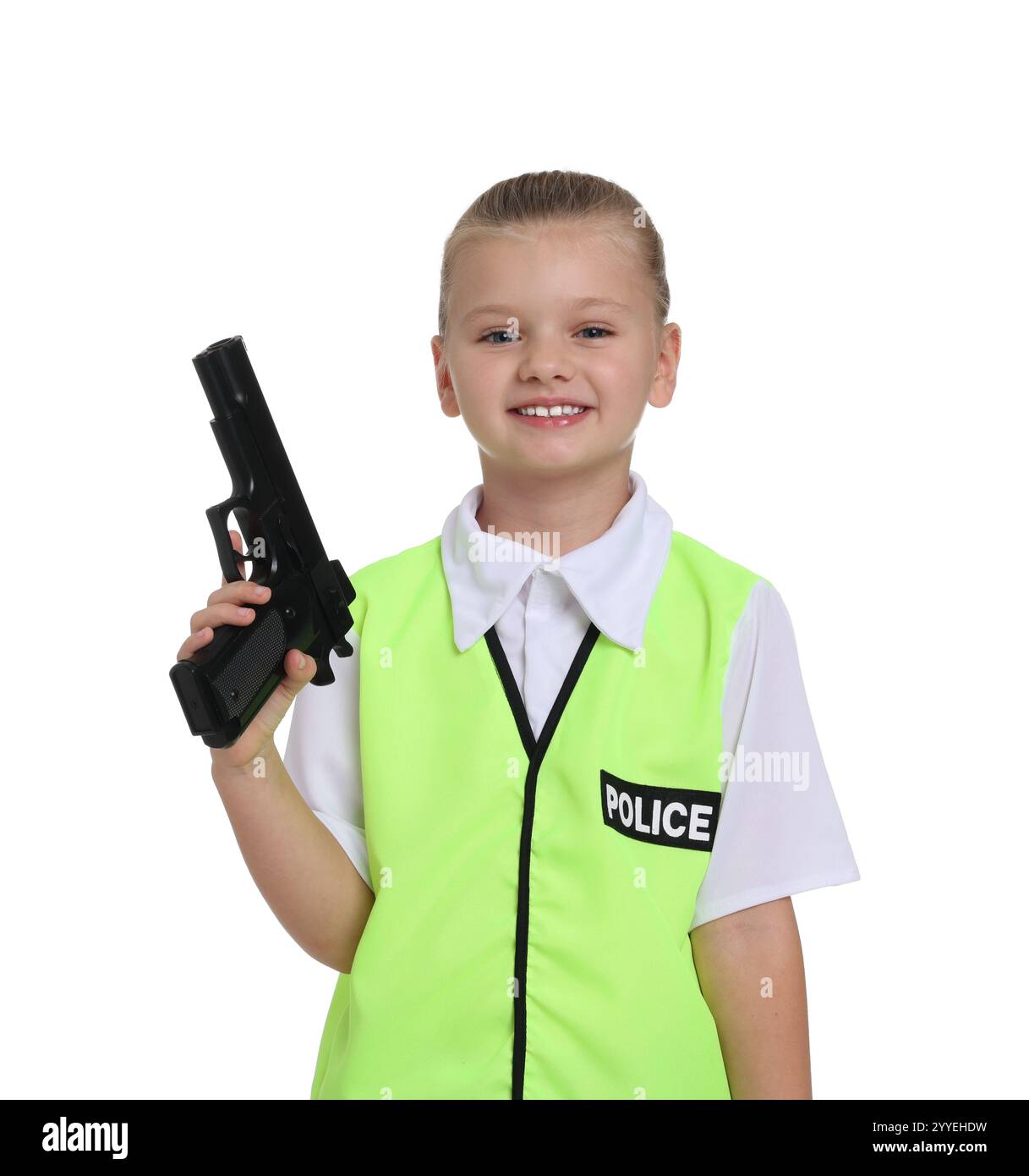 Little girl with gun pretending to be policewoman on white background ...
