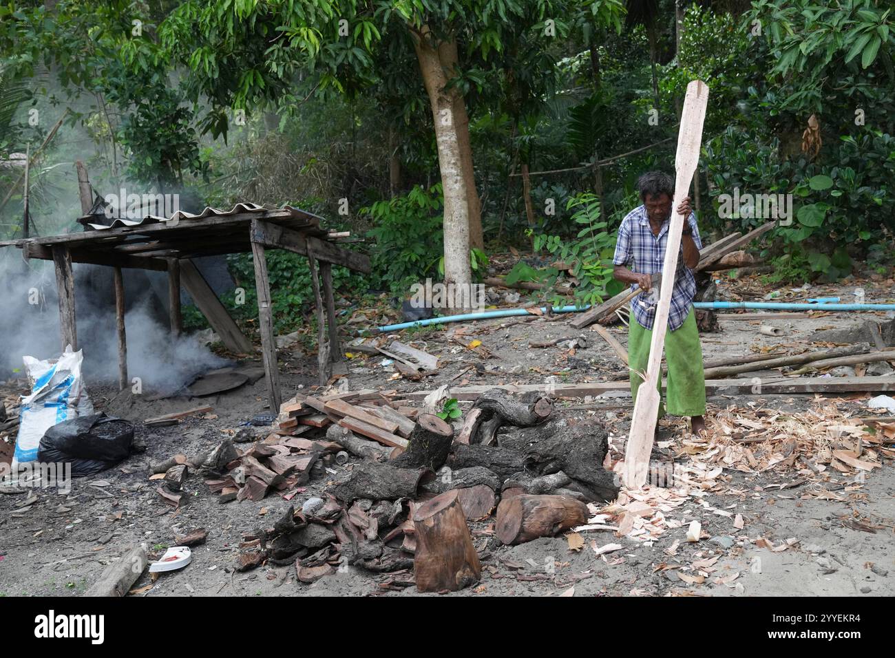Tat Klathale makes a paddle in Moken village at Surin Islands in Phang ...