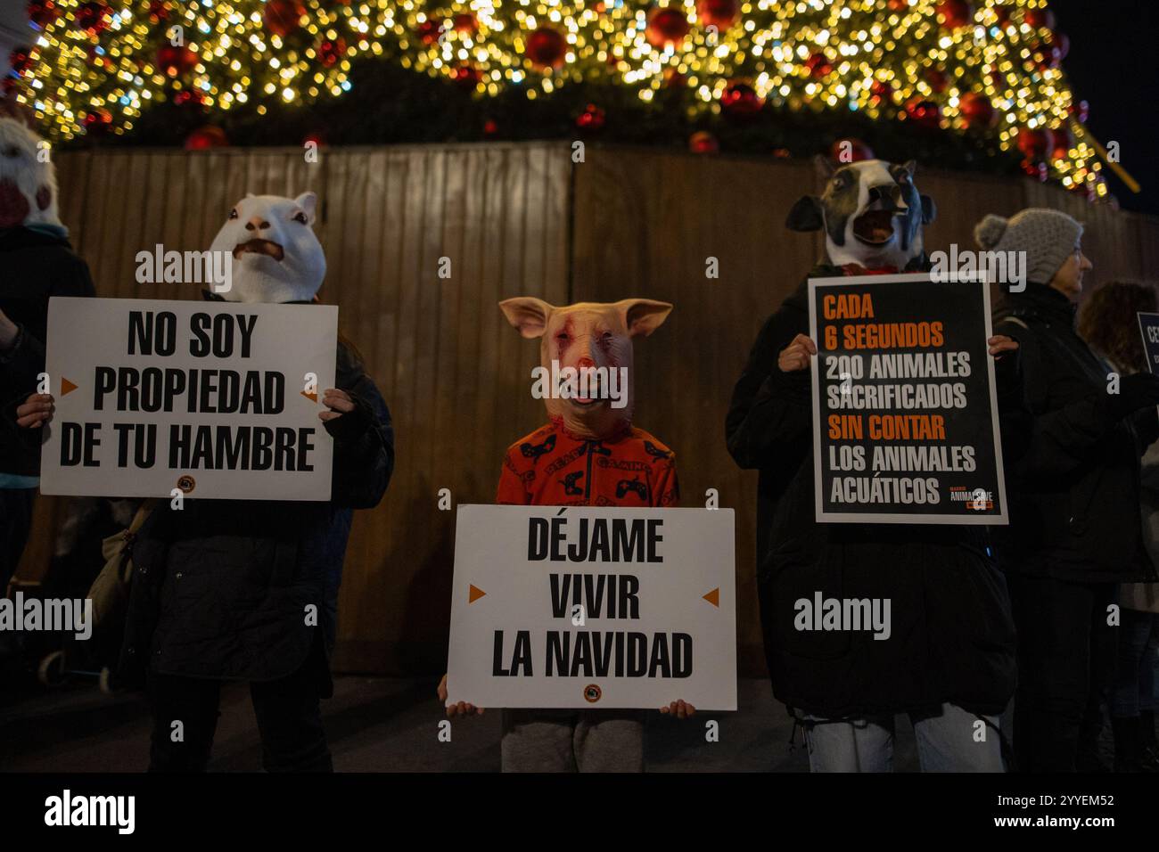 Madrid, Spain. 21st Dec, 2024. Activists wearing animal masks hold ...