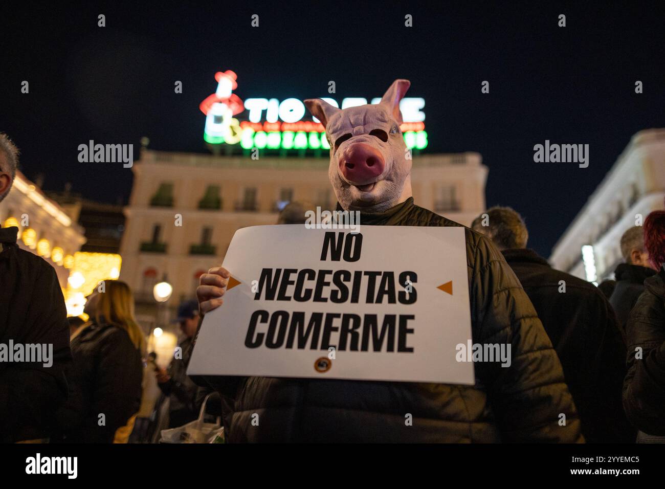 Madrid, Spain. 21st Dec, 2024. An activist wearing an animal mask holds ...
