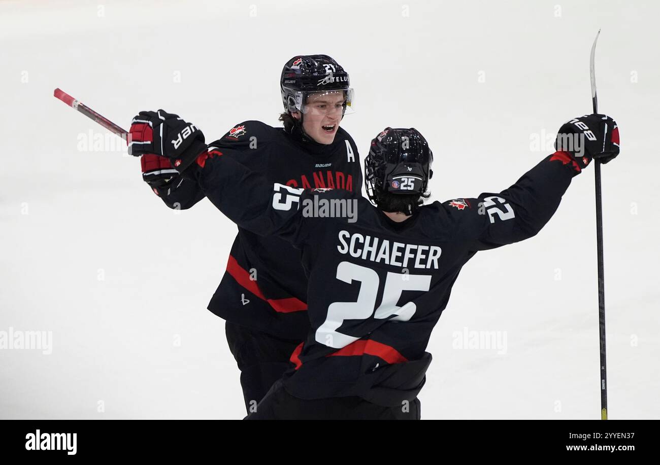 Ottawa, Canada. 21st Dec, 2024. Canada forward Calum Ritchie celebrates ...