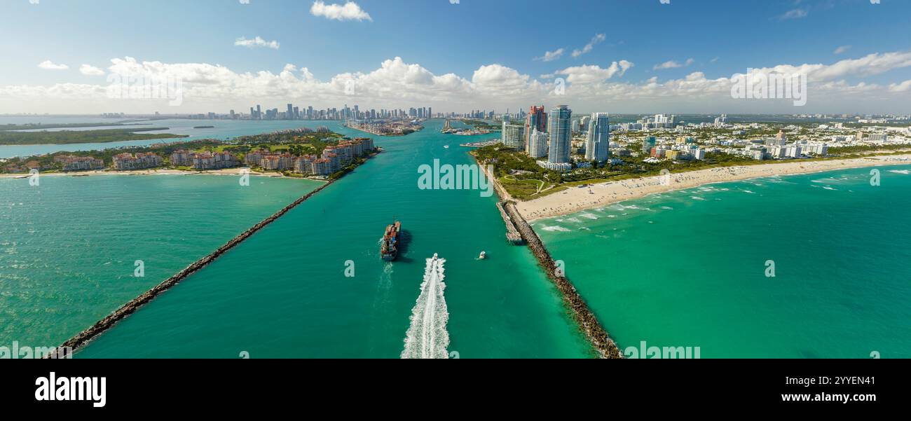 Aerial view of container ship entering in Miami harbor main channel ...