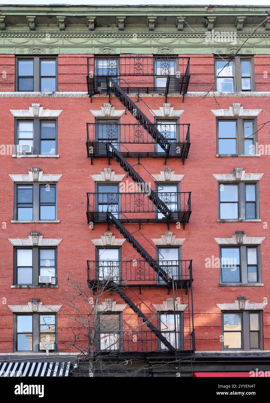 New York City, old apartment building with external fire ladder and ...